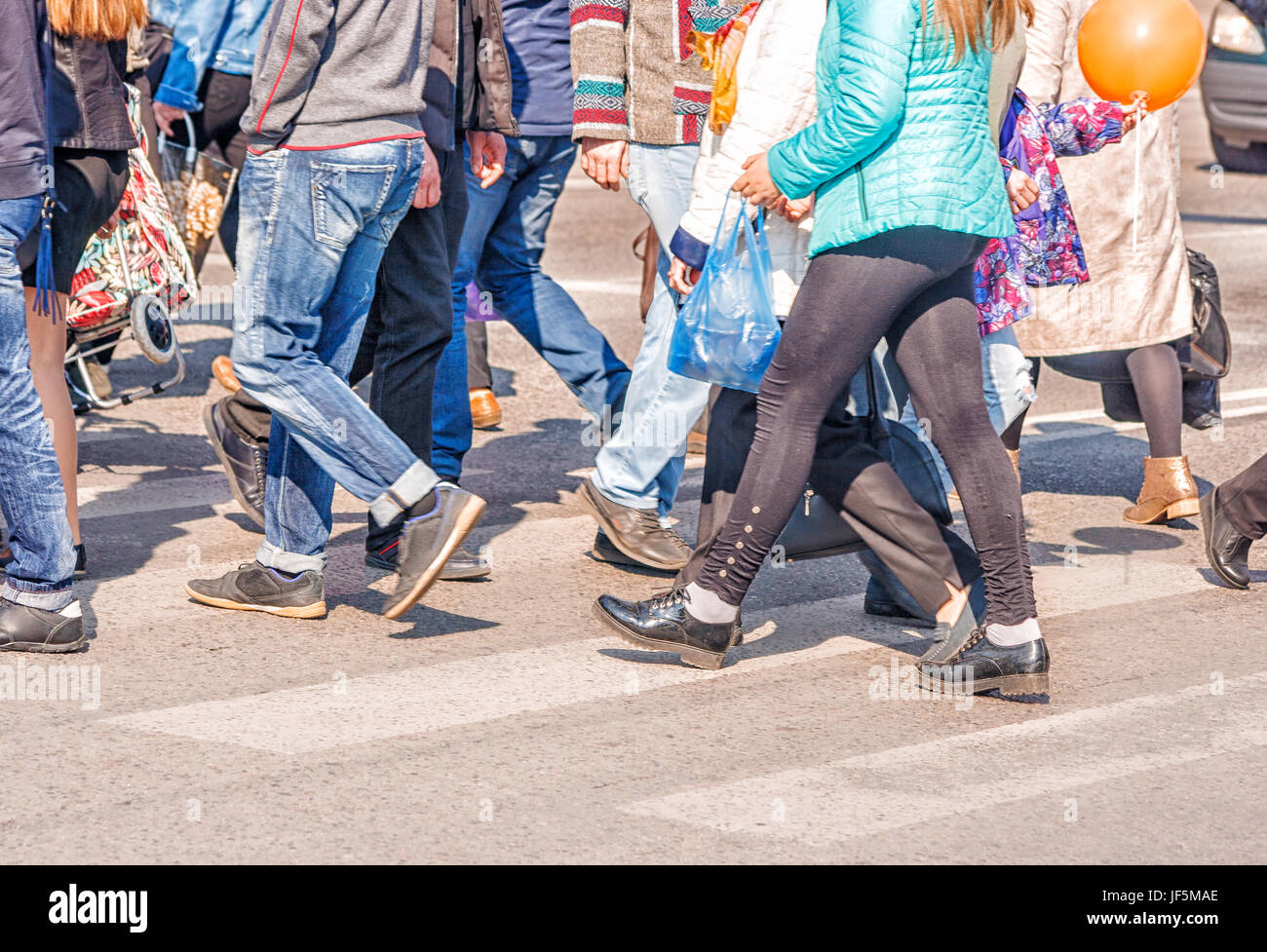 crossroad with walking pedestrians on sunny summer day Stock Photo - Alamy