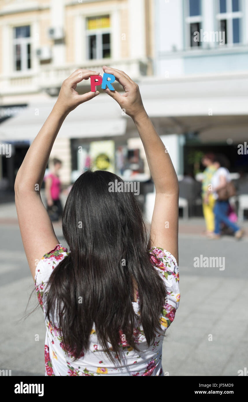 Women hold wooden letters PR Stock Photo - Alamy