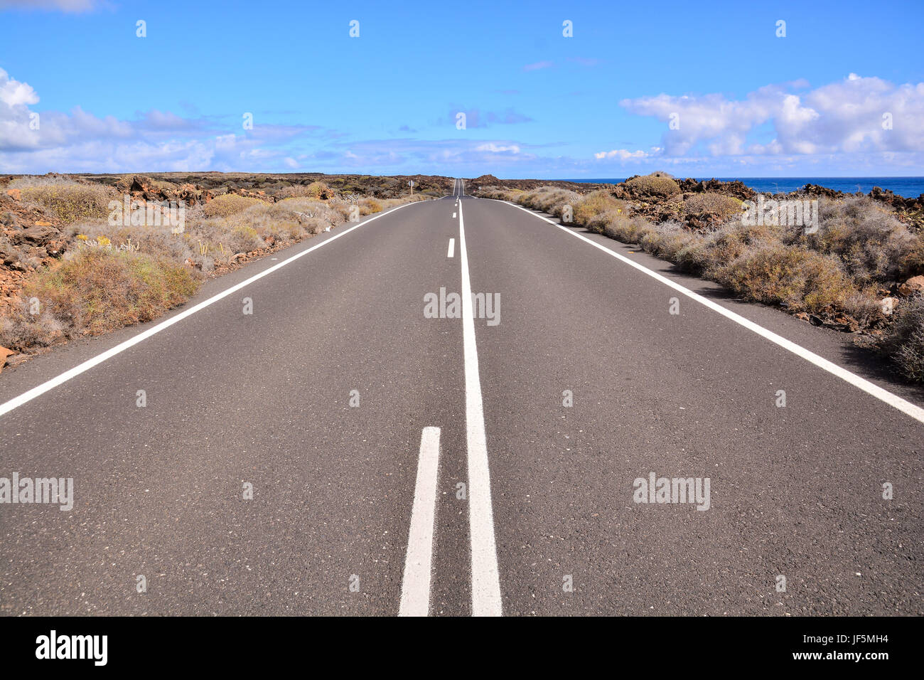 Long Lonely Road Stock Photo - Alamy