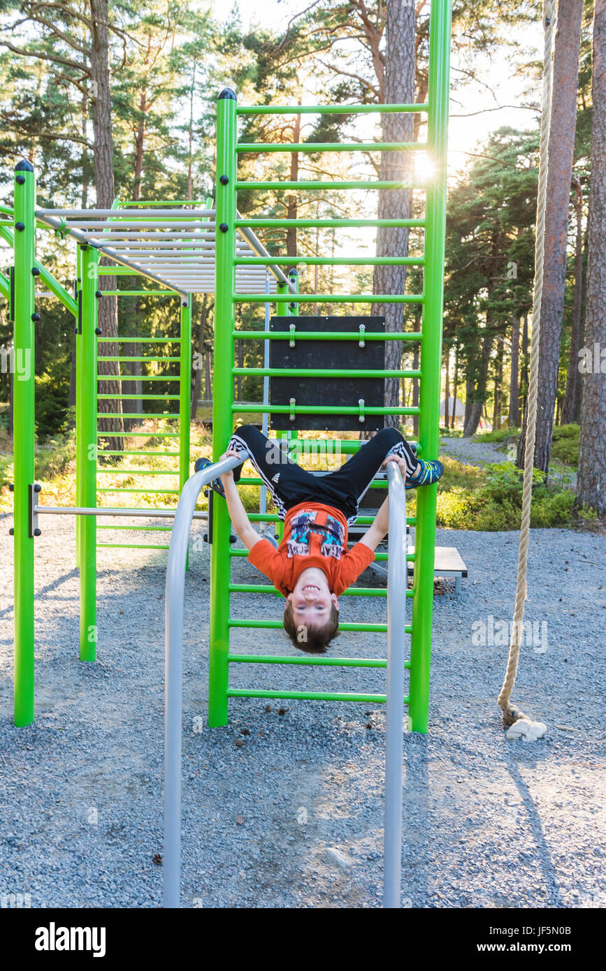 Boy on playground Stock Photo - Alamy