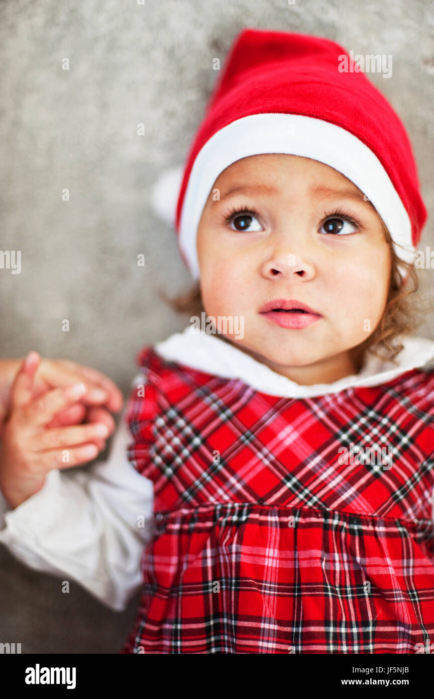 Small girl in father christmas hi-res stock photography and images - Alamy