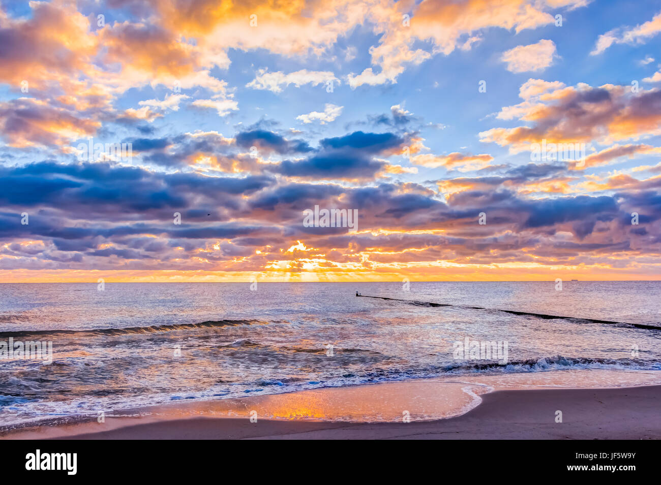 Sunrise at the beach Stock Photo - Alamy