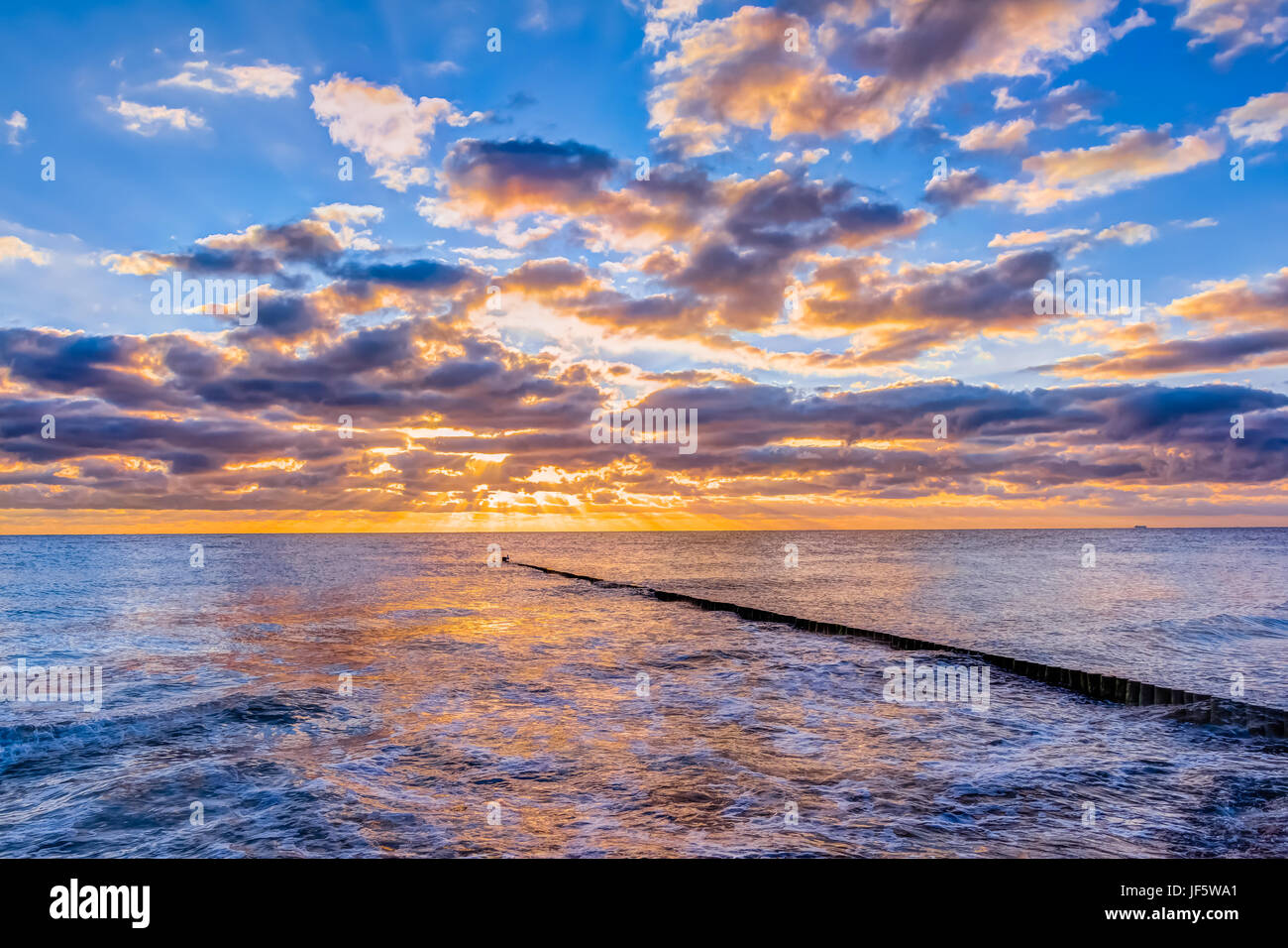 Sunrise at the beach Stock Photo - Alamy