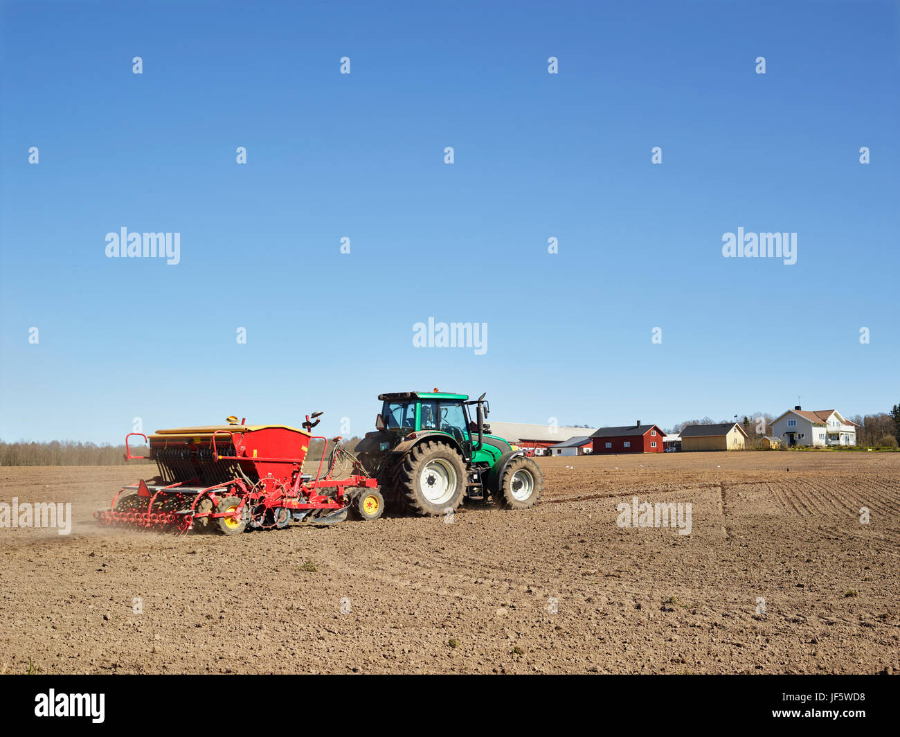 Tractor on field Stock Photo - Alamy