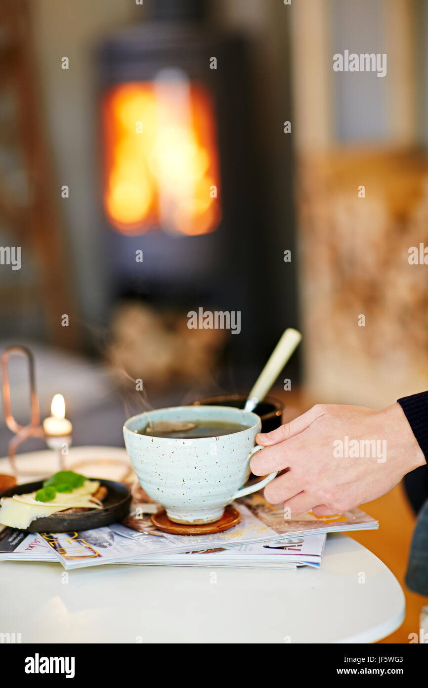 Hand with cup Stock Photo - Alamy