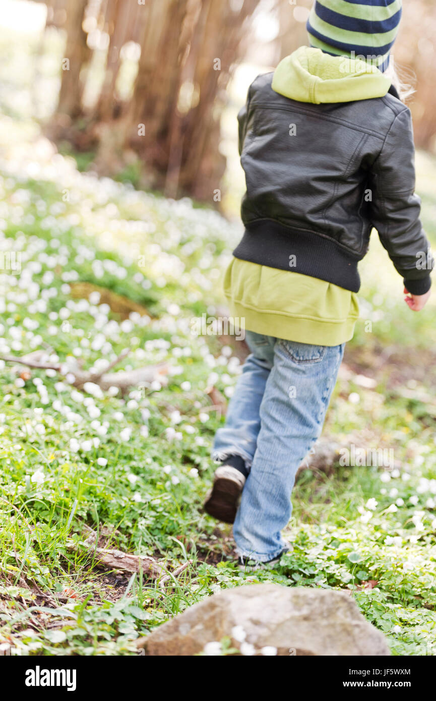 Girl walking in meadow Stock Photo - Alamy