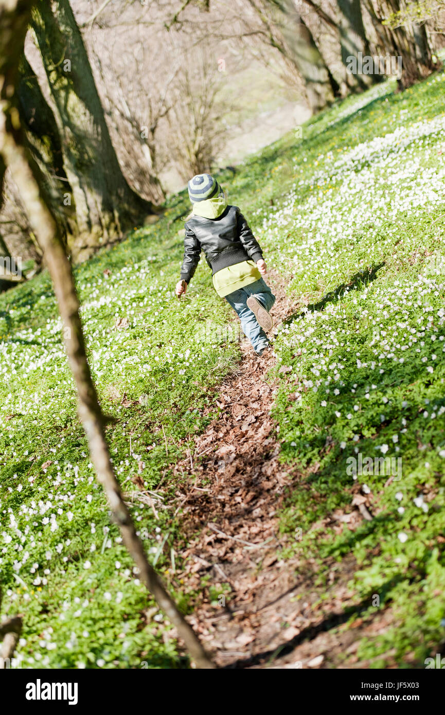 Girl walking in meadow Stock Photo - Alamy