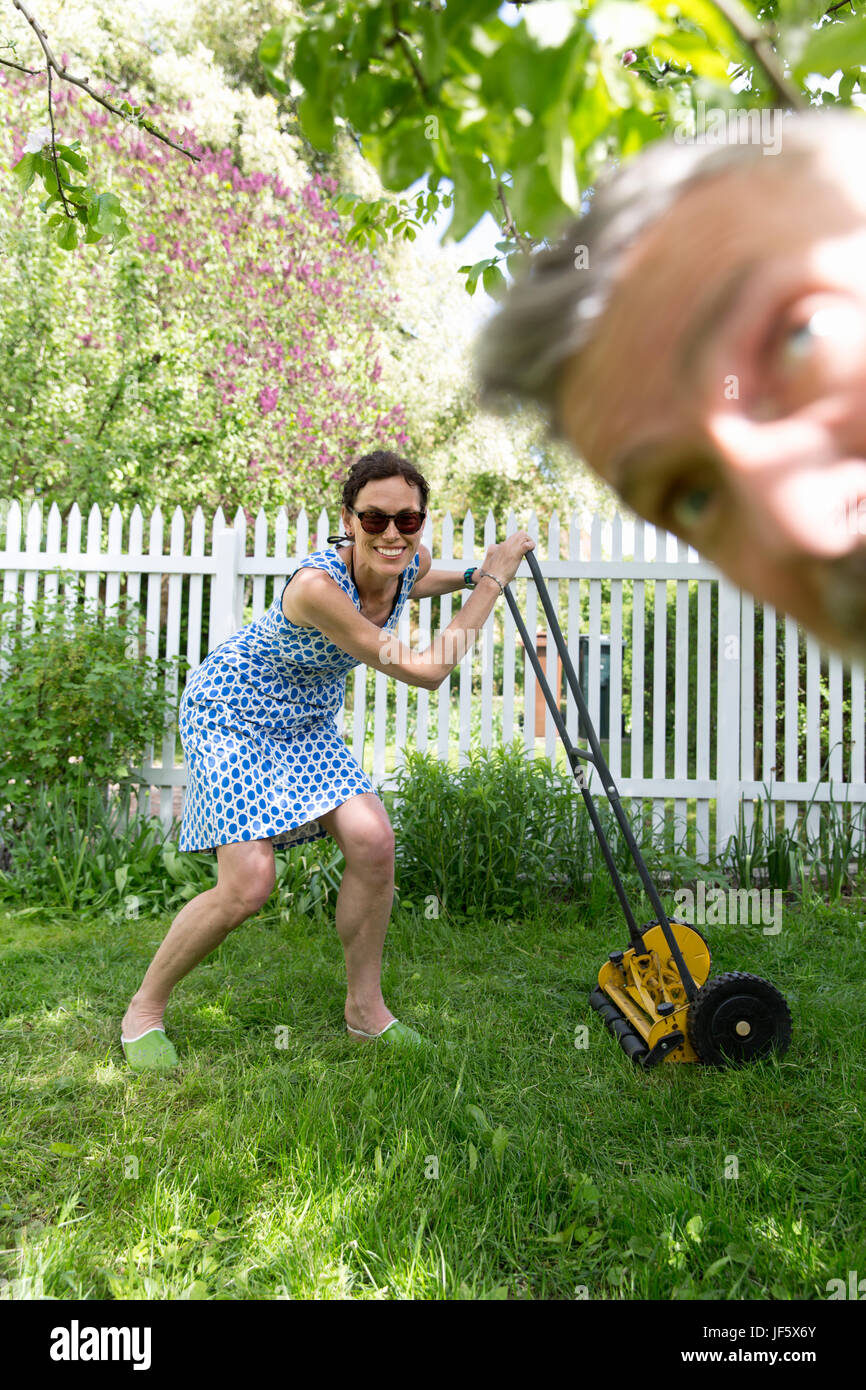 Woman mowing lawn hi-res stock photography and images - Alamy