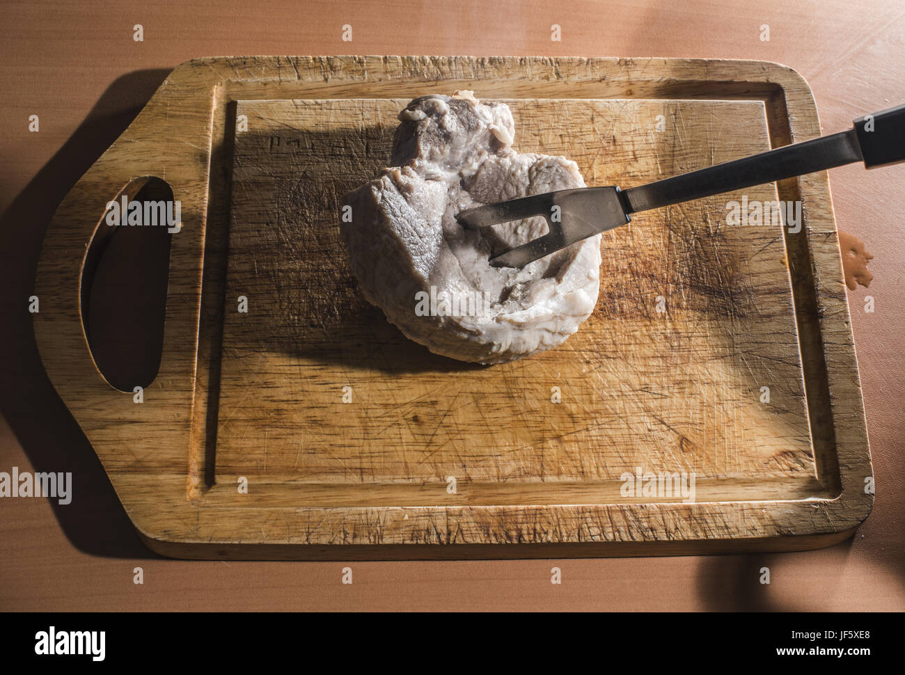 Cutting cooked meat Stock Photo - Alamy
