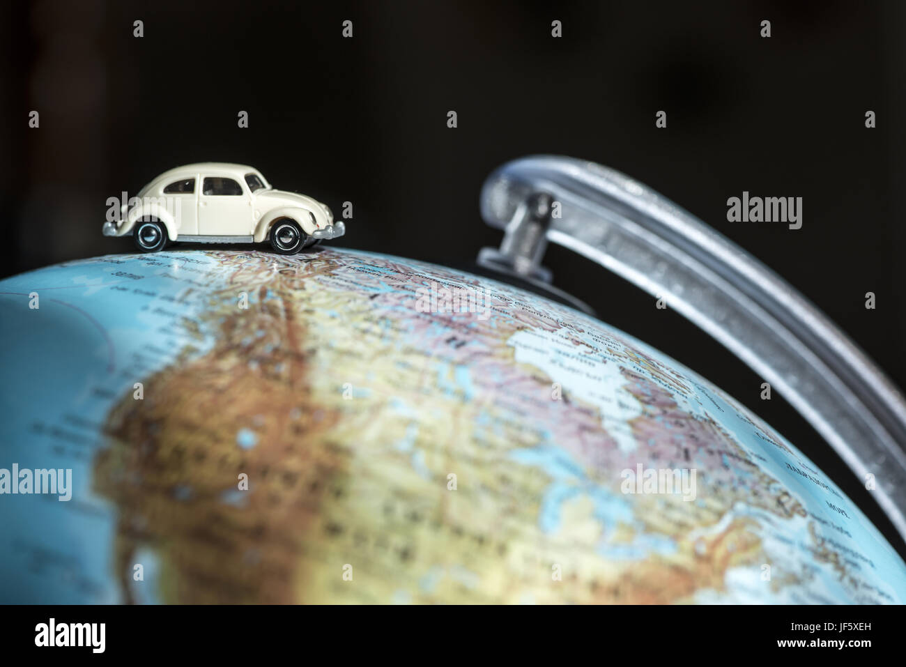 Car on globe Stock Photo - Alamy