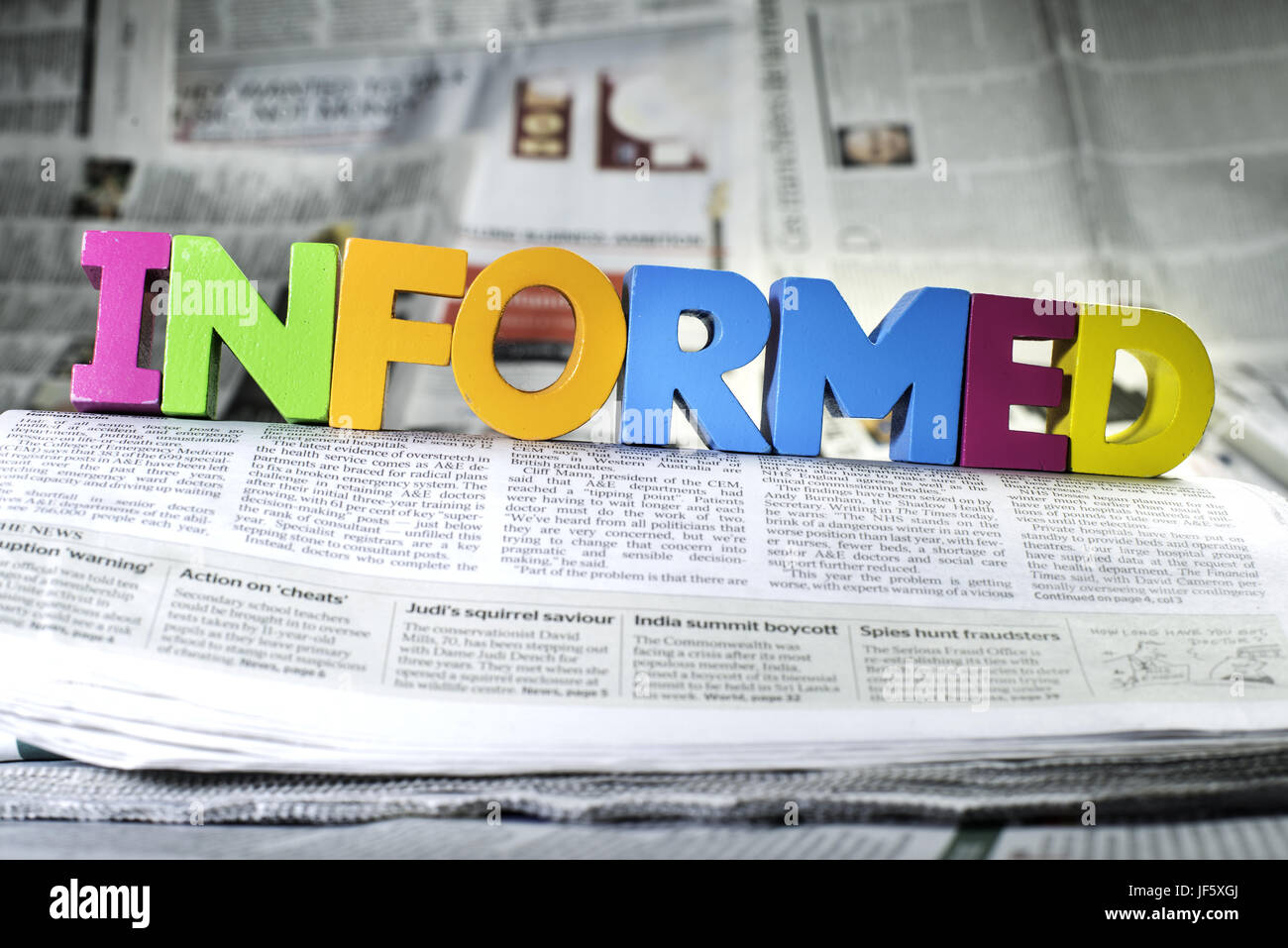 Word informed on newspaper Stock Photo - Alamy