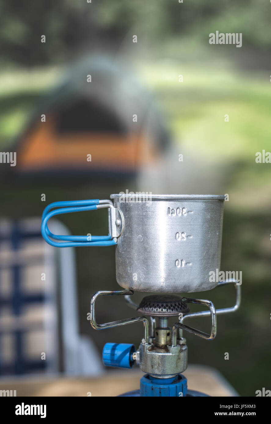 Tourist cup on gas stove Stock Photo - Alamy