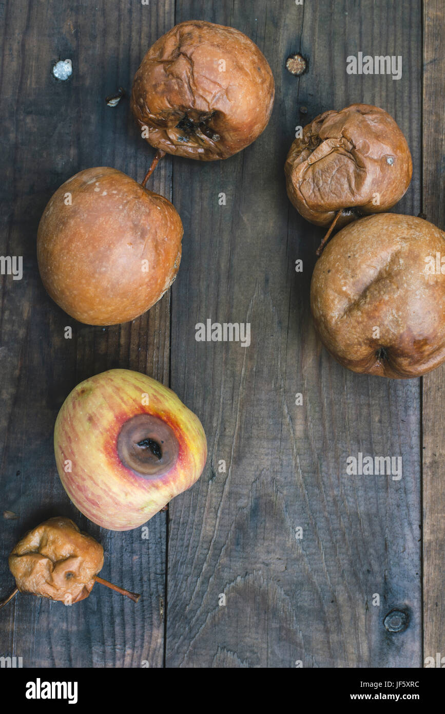 Rotten apples on wood Stock Photo - Alamy