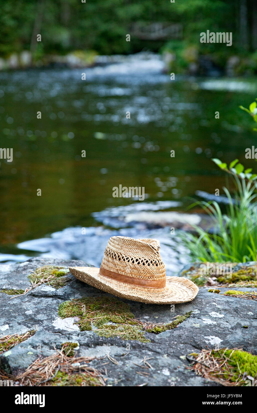 Straw hat at water Stock Photo - Alamy