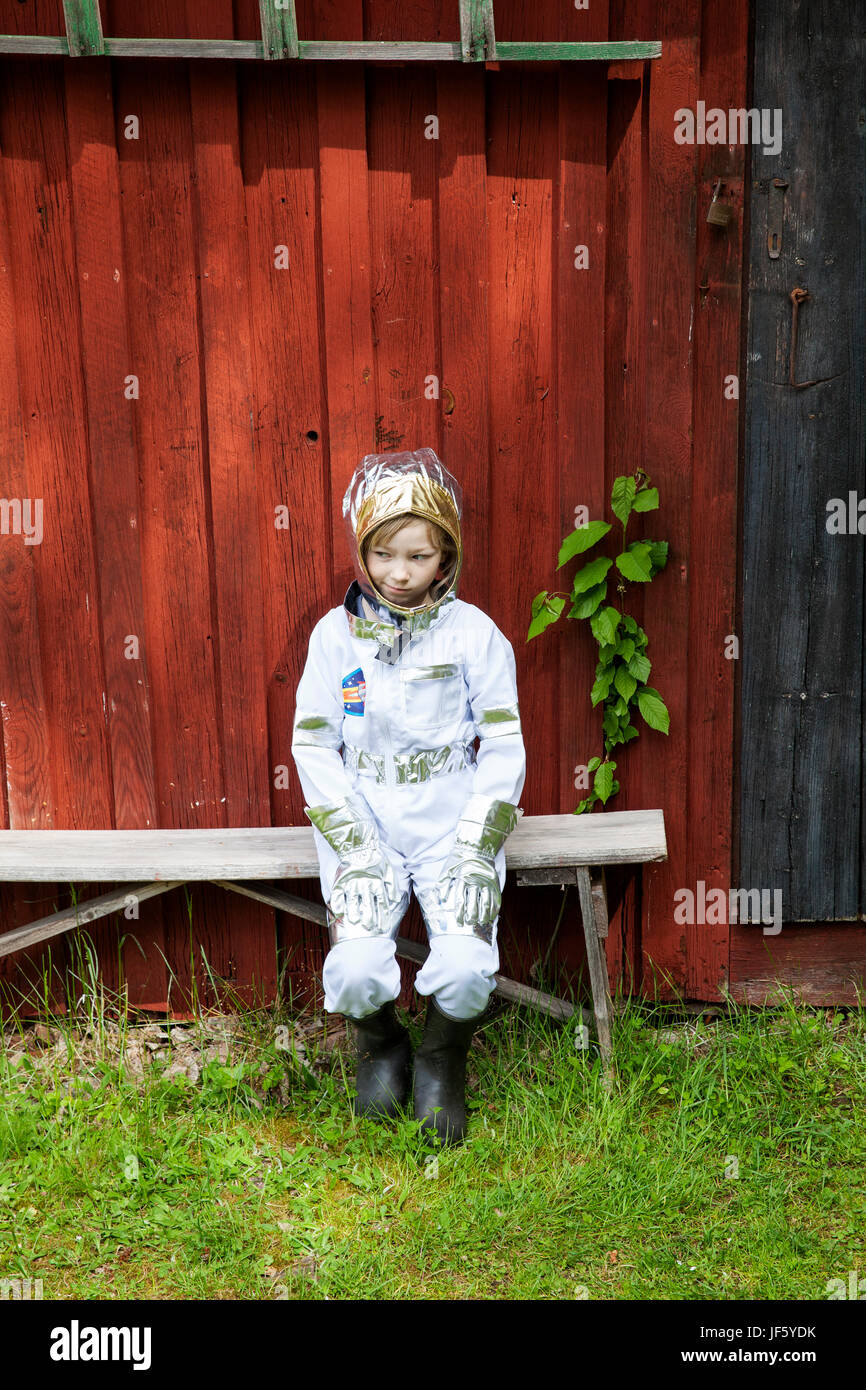 Girl in costume sitting on bench Stock Photo - Alamy