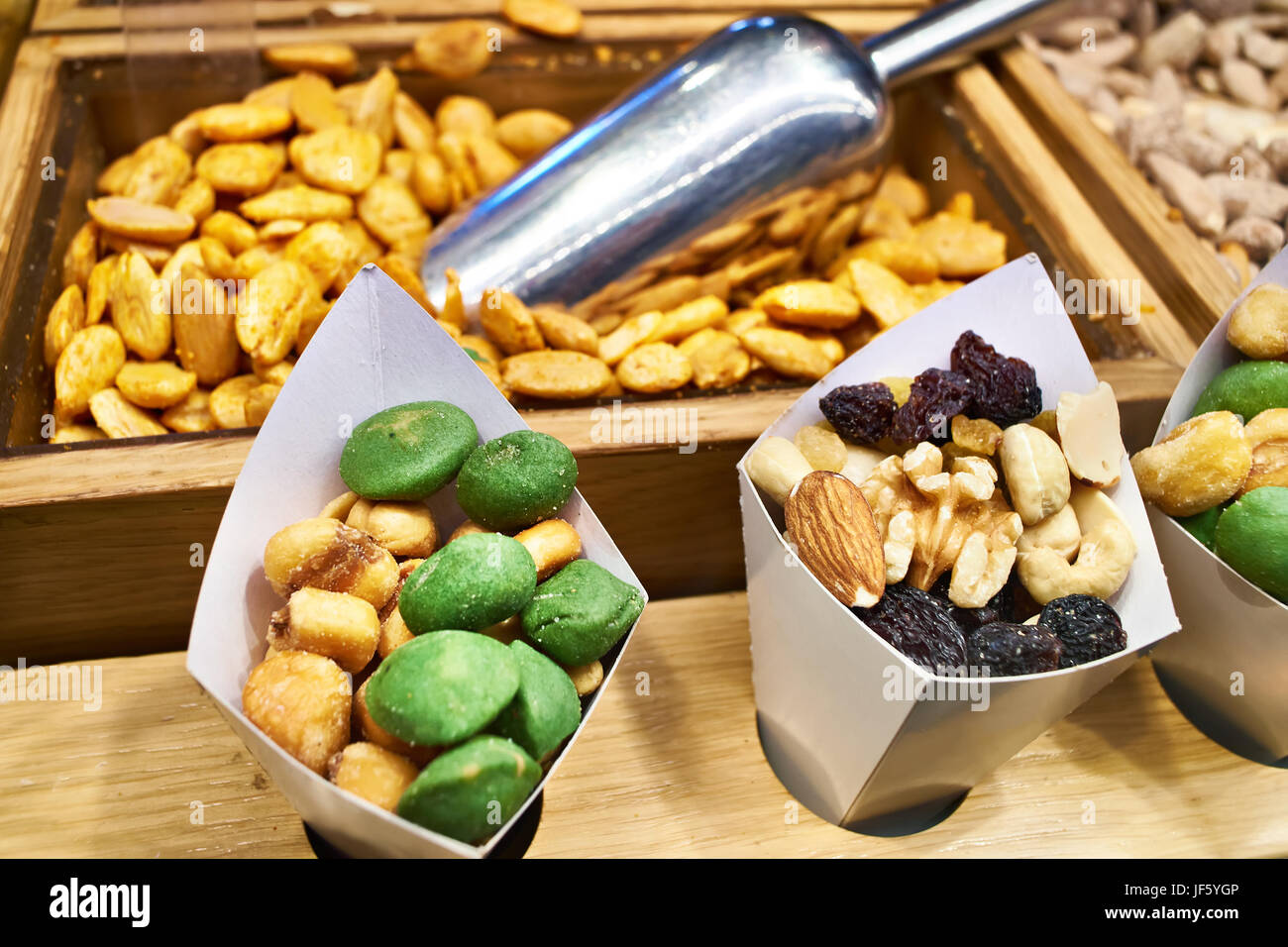 Almond and other nuts on store shelves Stock Photo - Alamy