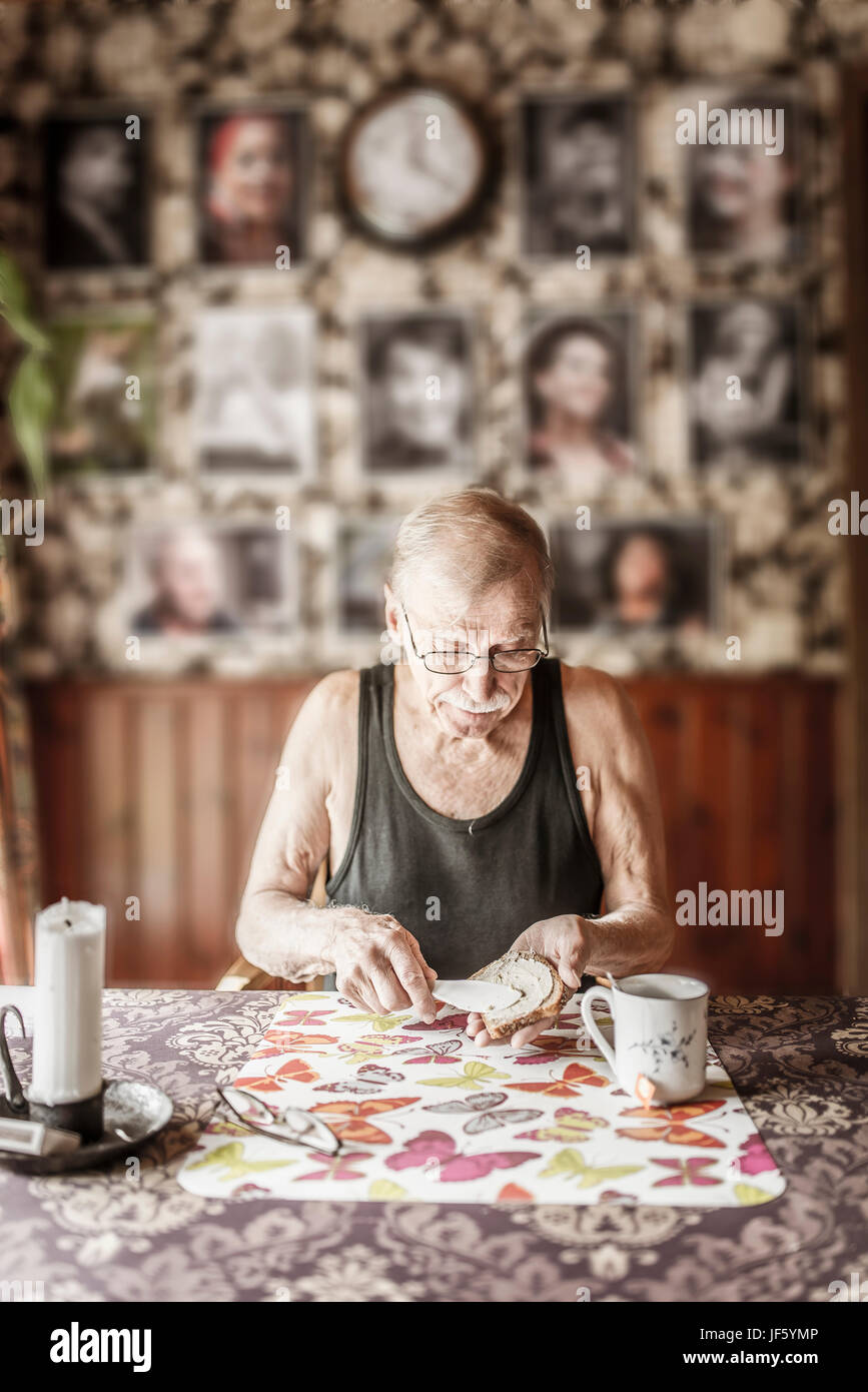 Old man eating bread hi-res stock photography and images - Alamy