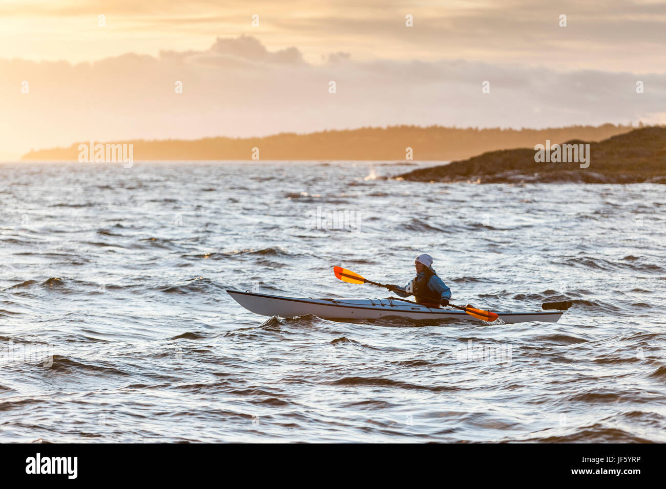 Person kayaking on sea Stock Photo - Alamy