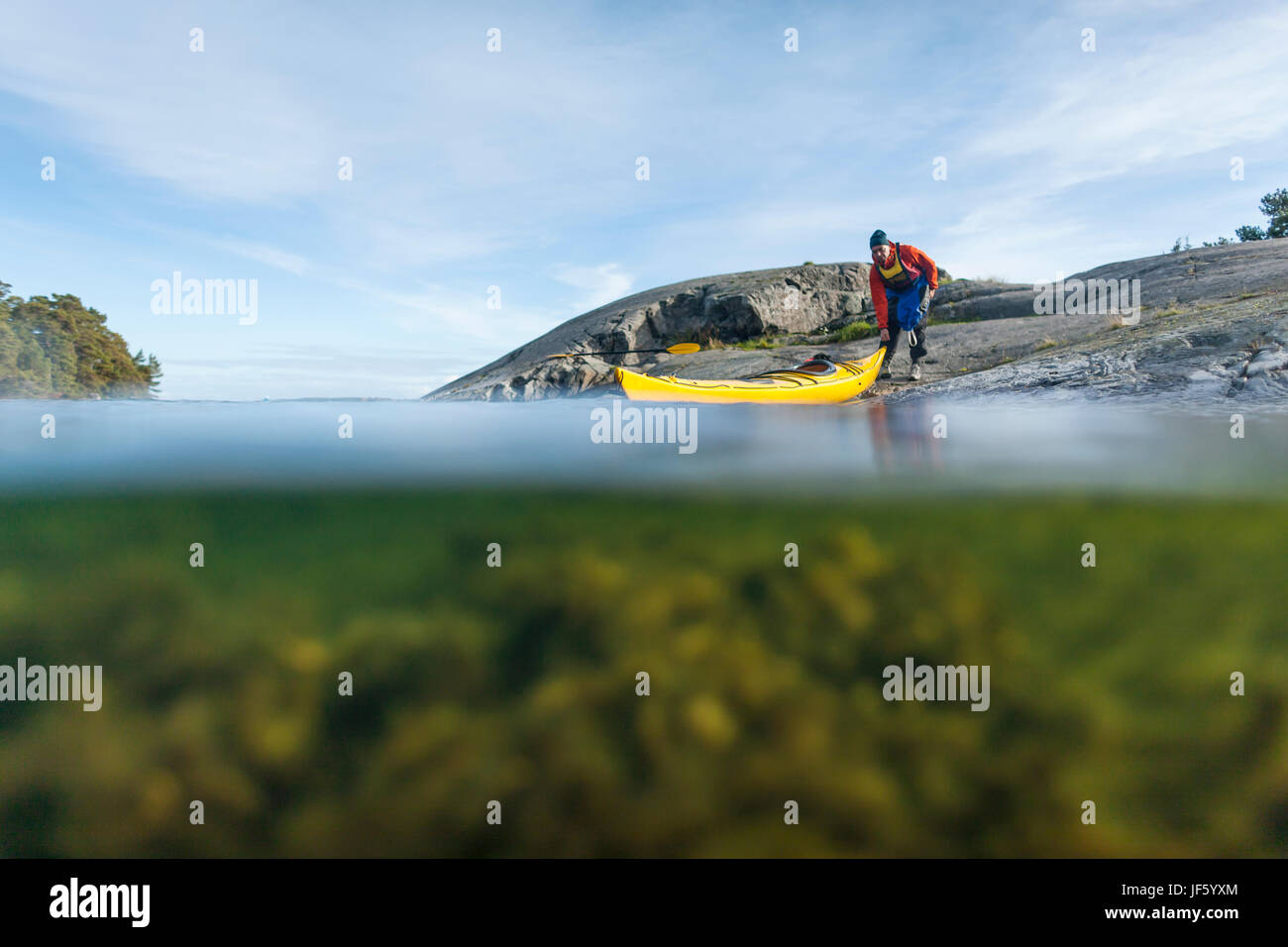 Person with kayak at sea Stock Photo - Alamy