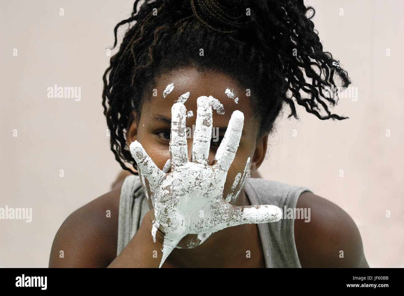 young girl painting and soiling Stock Photo - Alamy