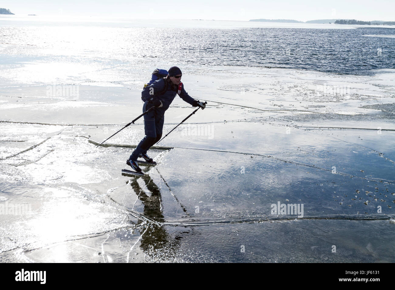 Man long distance skating Stock Photo - Alamy