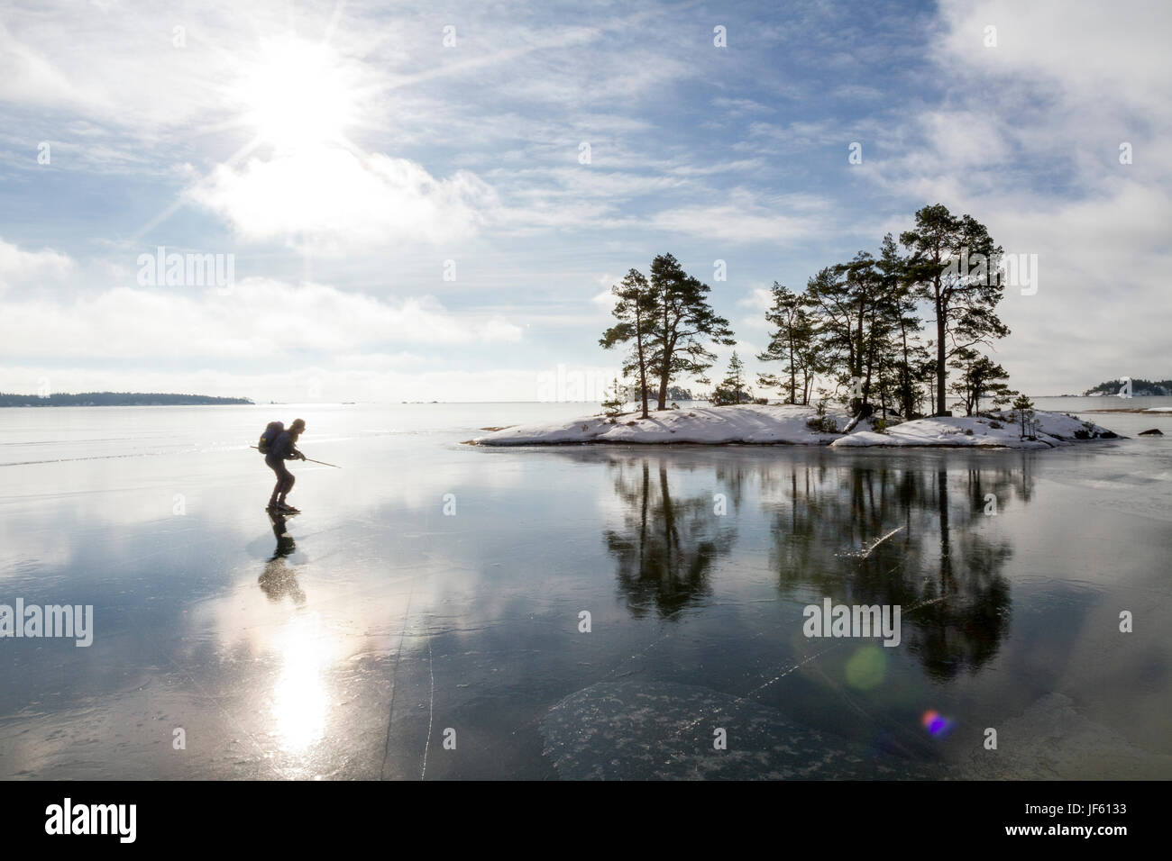 Silhouette of person long distance skating Stock Photo - Alamy