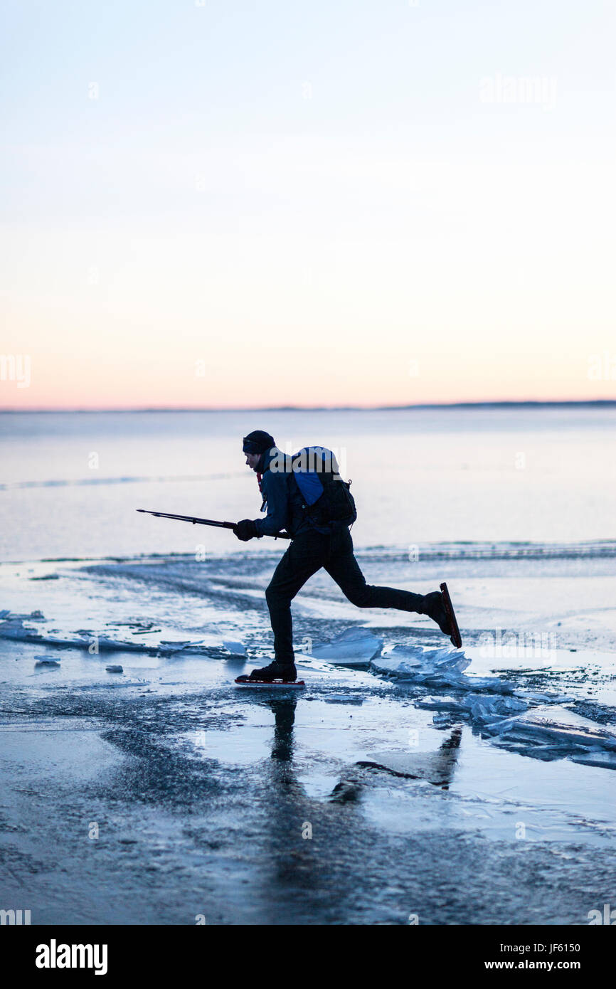 Man long-distance skating Stock Photo - Alamy