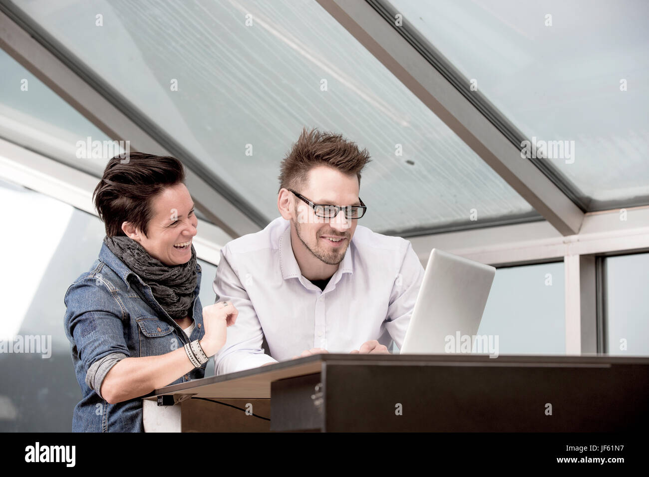 Professionals in office Stock Photo - Alamy