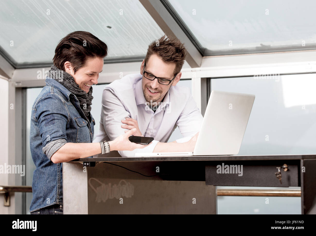 Professionals in office Stock Photo - Alamy