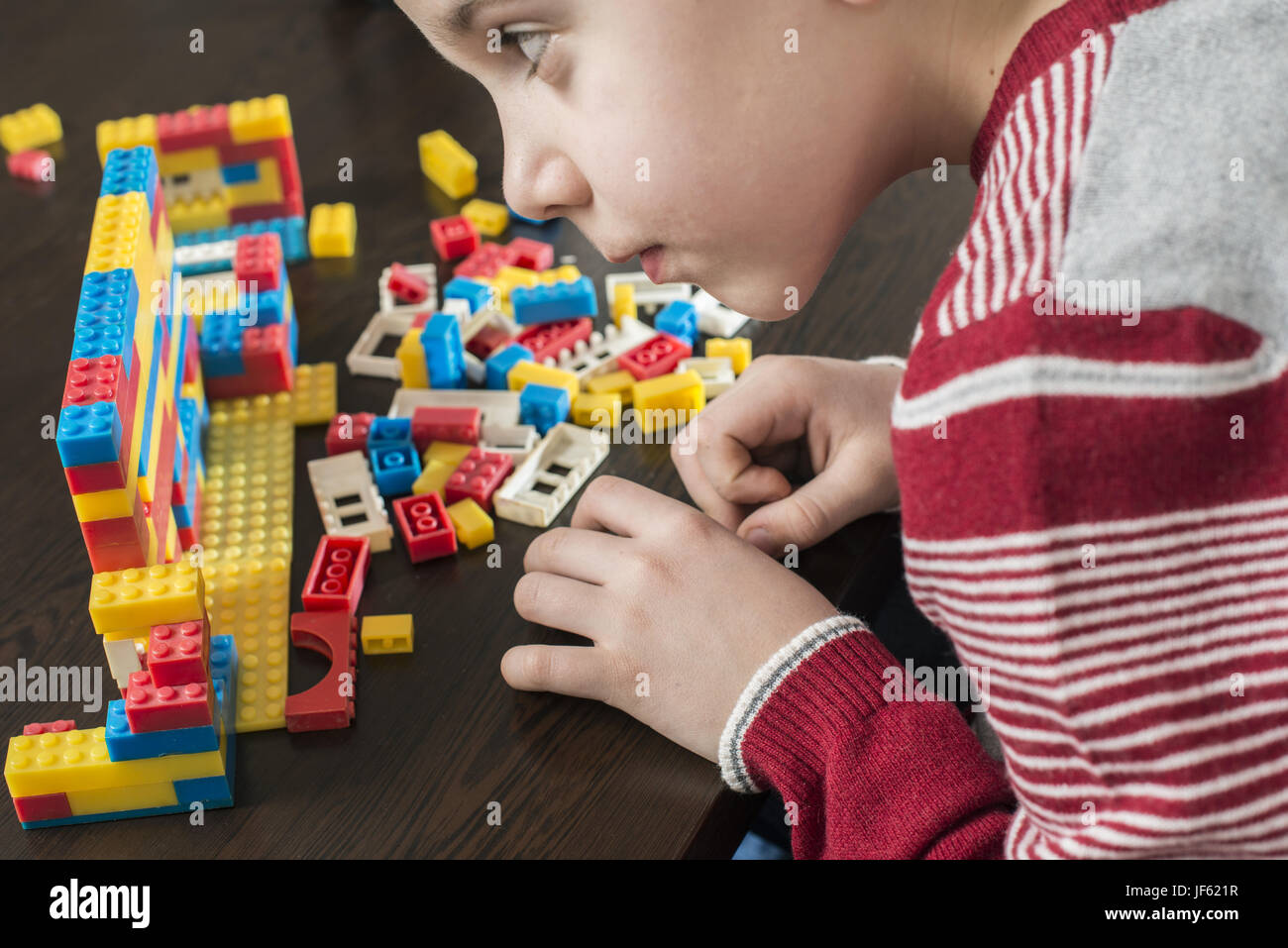 Child play with children's constructor toys Stock Photo - Alamy