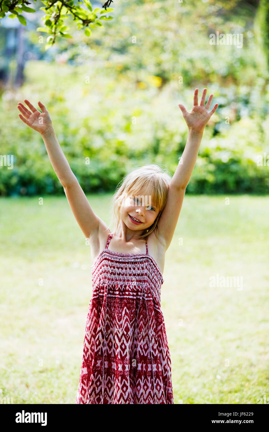 Girl with raised arms Stock Photo - Alamy