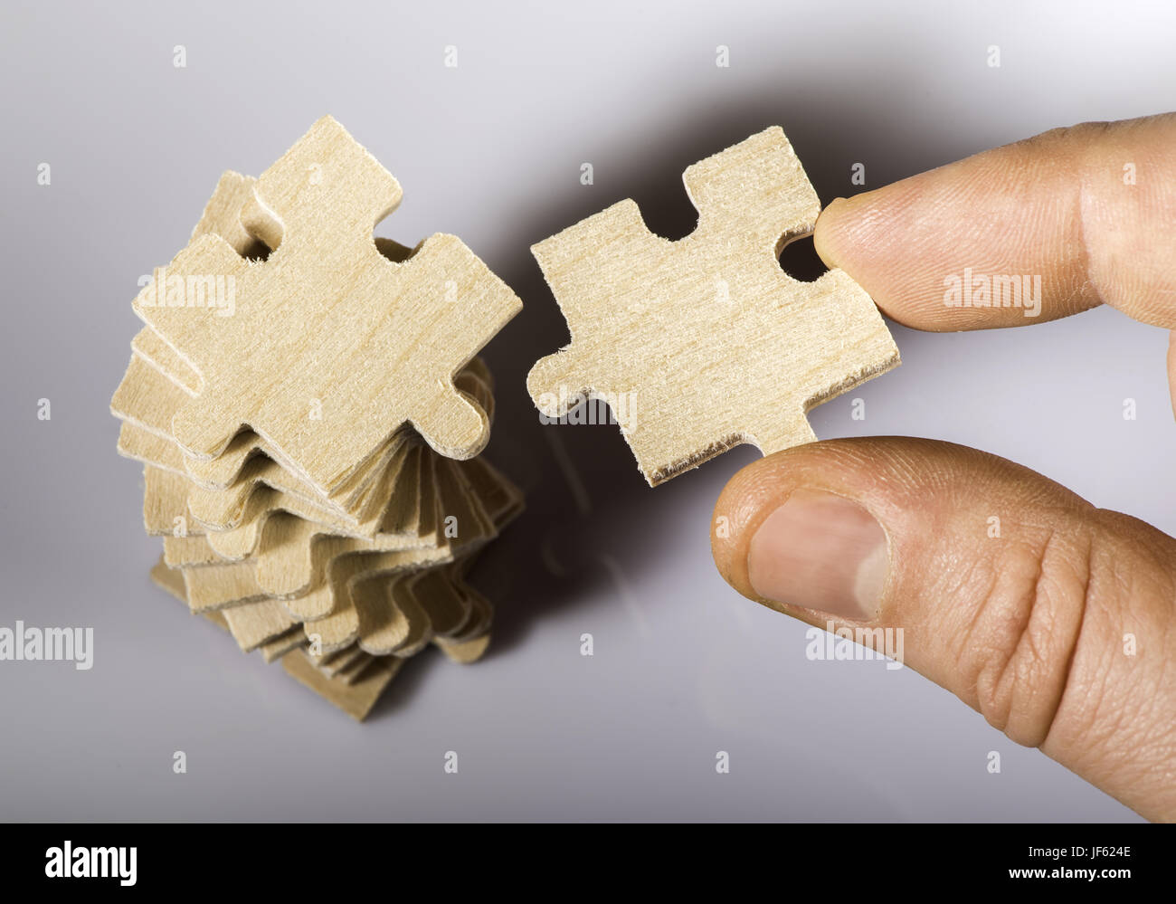 Wooden puzzle on white background Stock Photo - Alamy