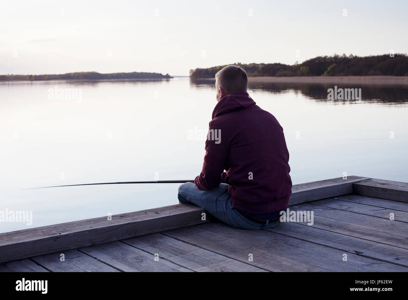 Man fishing by lake hi-res stock photography and images - Alamy