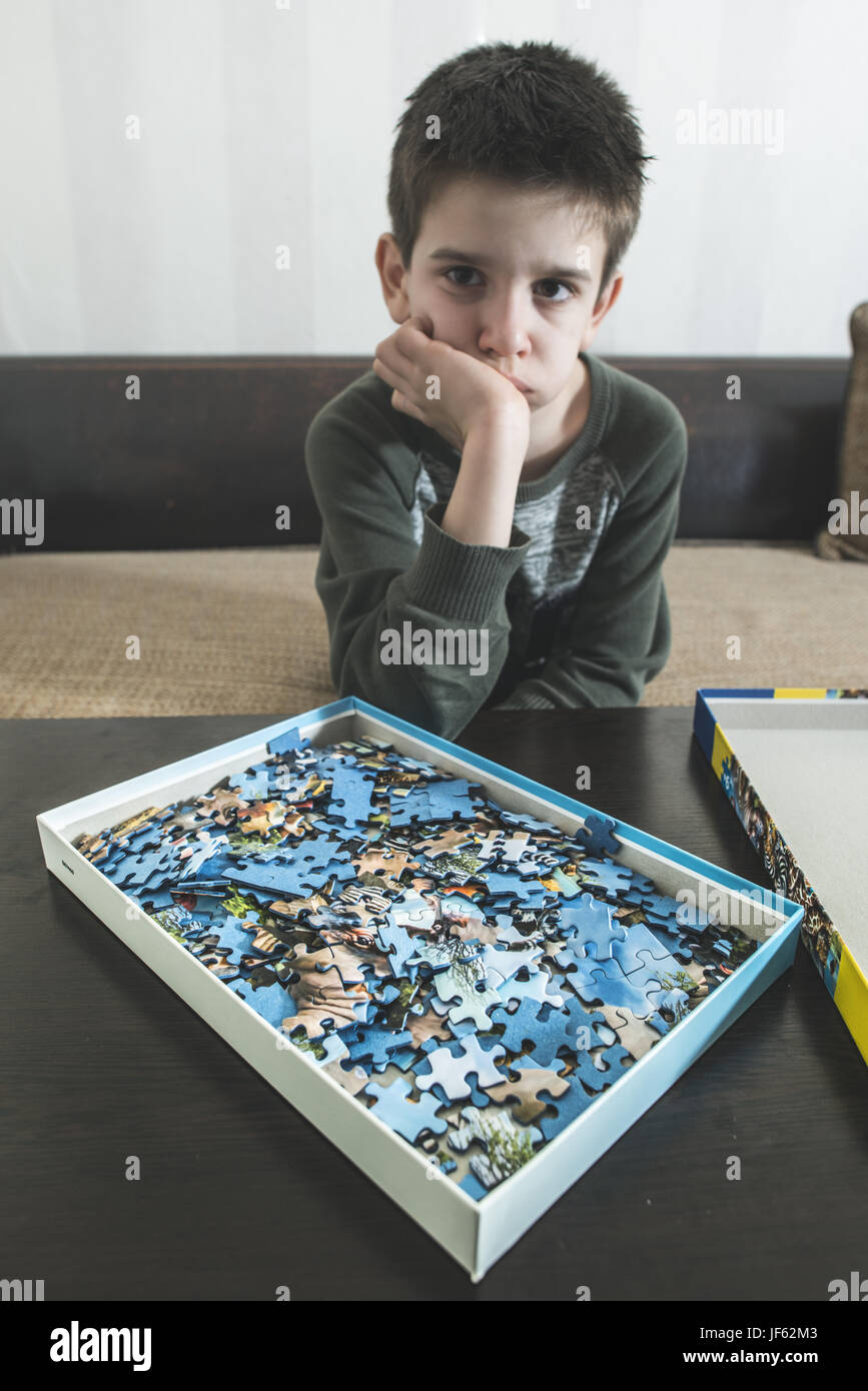 Child and puzzle Stock Photo - Alamy