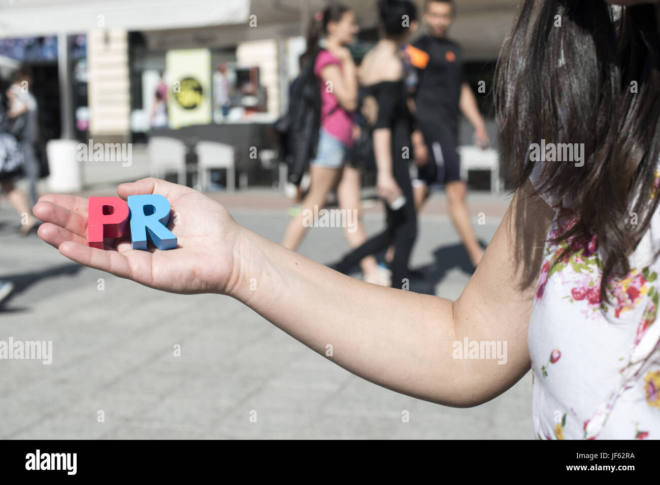 Women hold wooden letters PR Stock Photo - Alamy