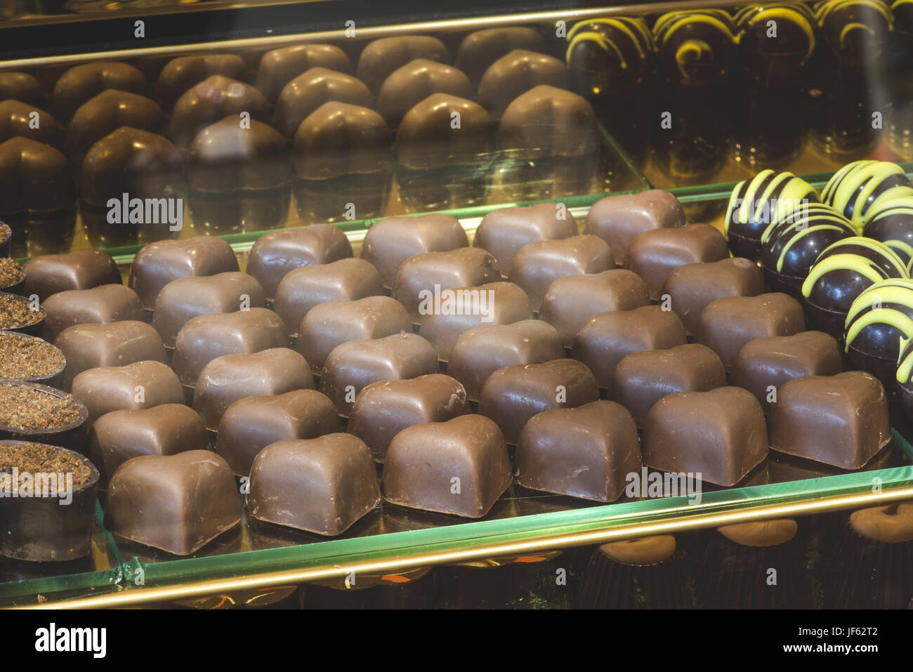 Chocolate candy in a store window Stock Photo - Alamy