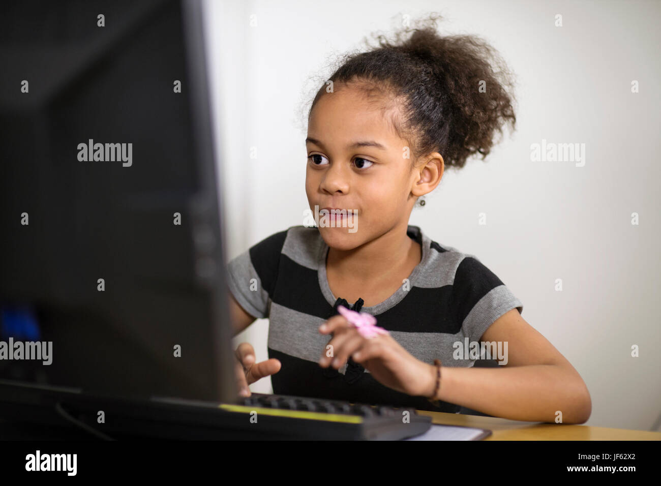 Girl using computer Stock Photo - Alamy