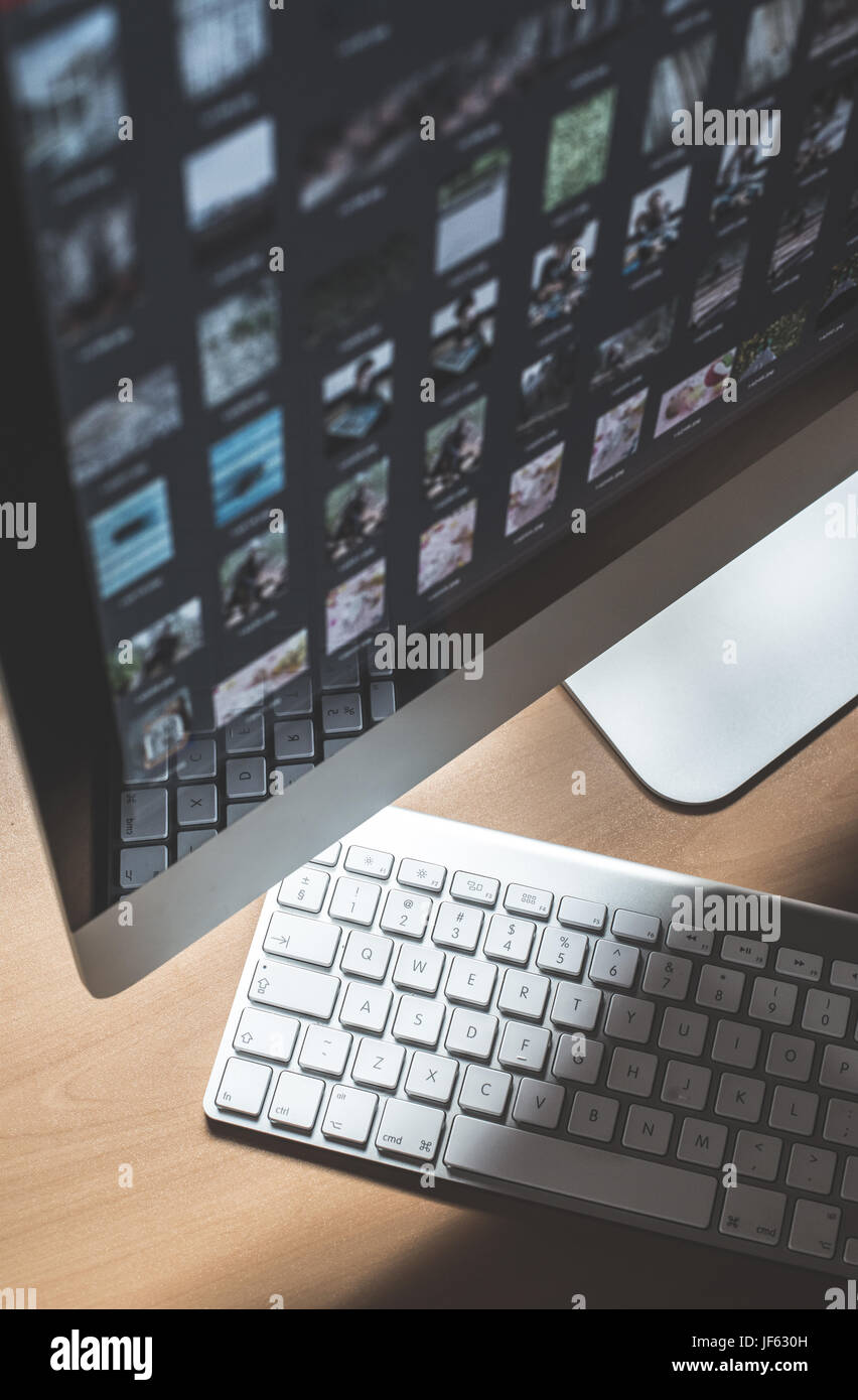 Photos on computer monitor Stock Photo - Alamy