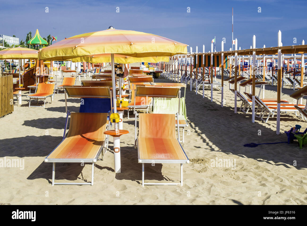 Sunbeds and umbrellas on the beach Stock Photo - Alamy