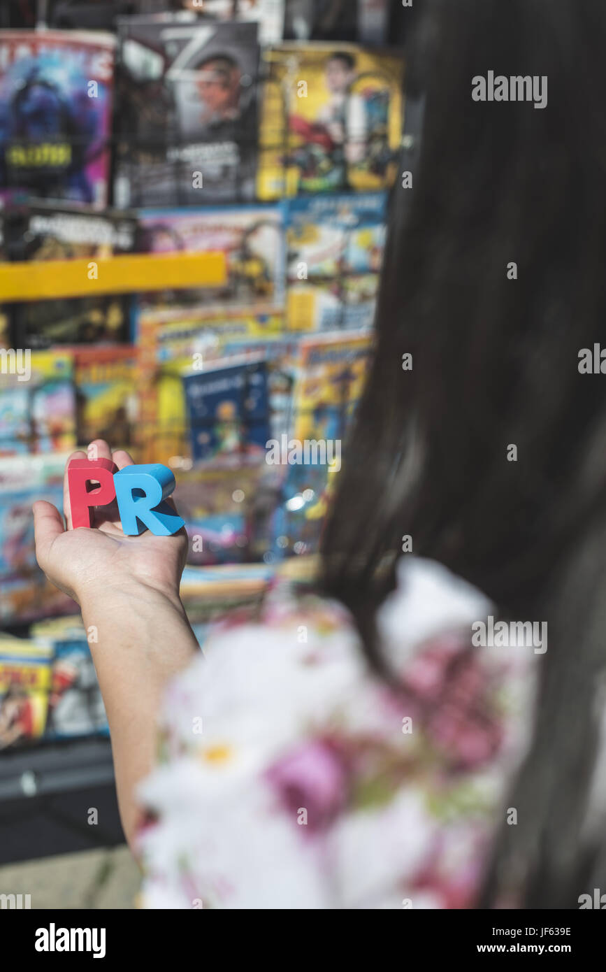 Women hold wooden letters PR Stock Photo - Alamy