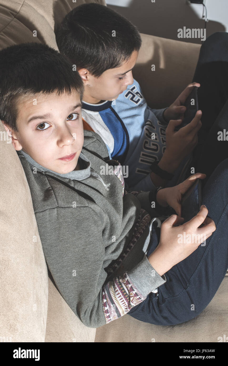 Children playing with their smartphones Stock Photo - Alamy