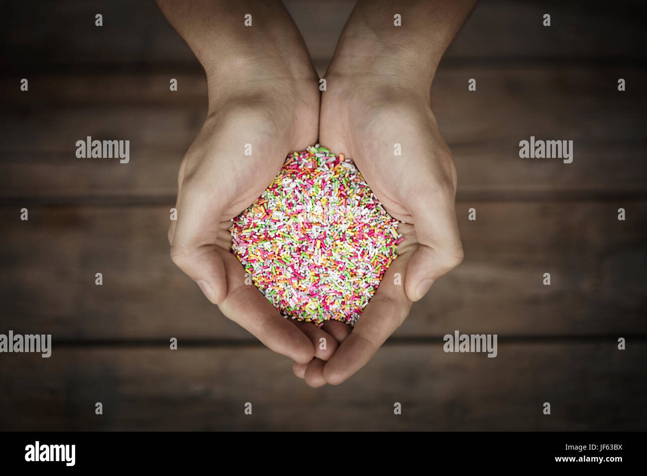 Sprinkles in mans hands, close-up Stock Photo - Alamy
