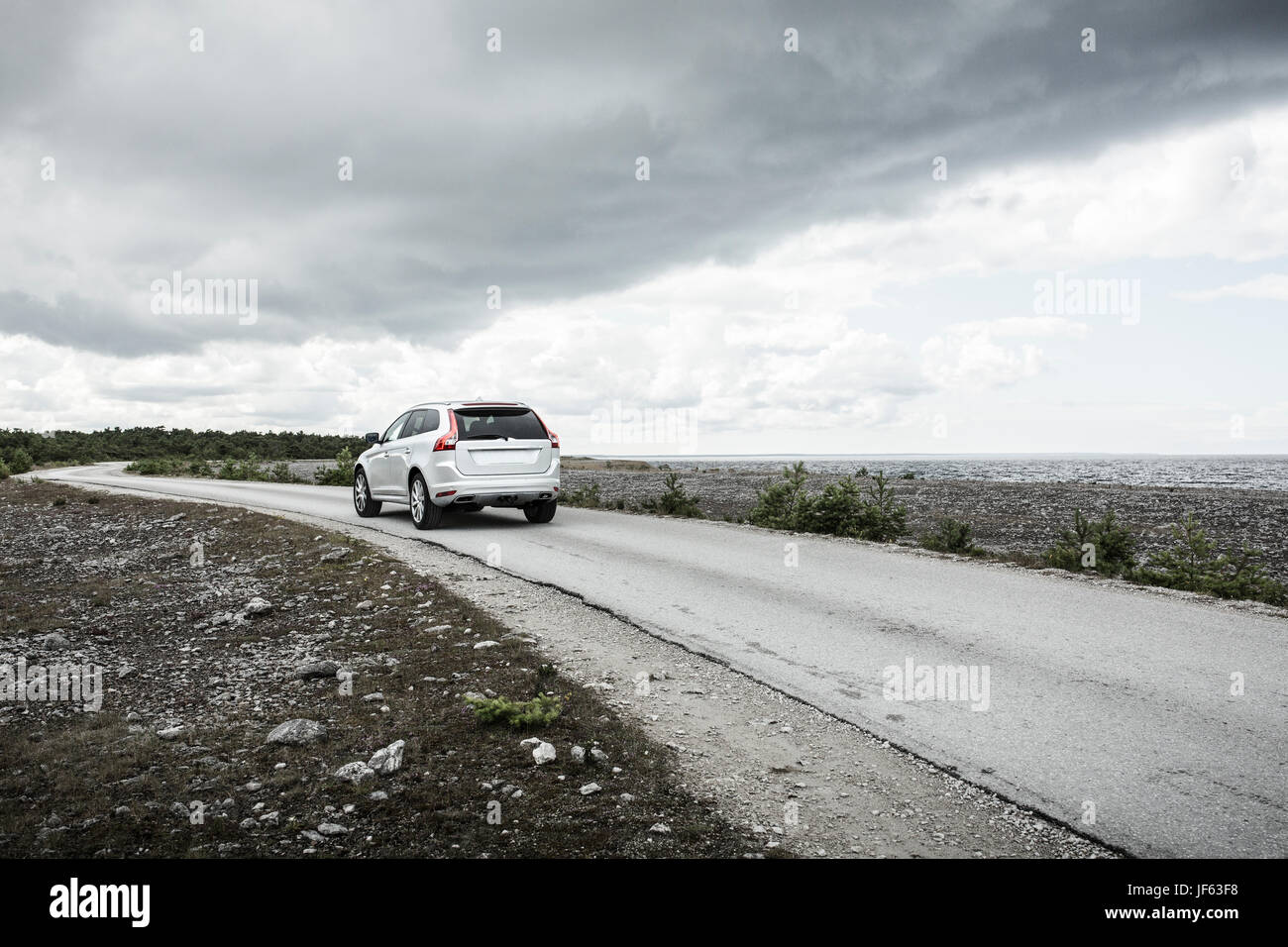 Car on country road Stock Photo - Alamy