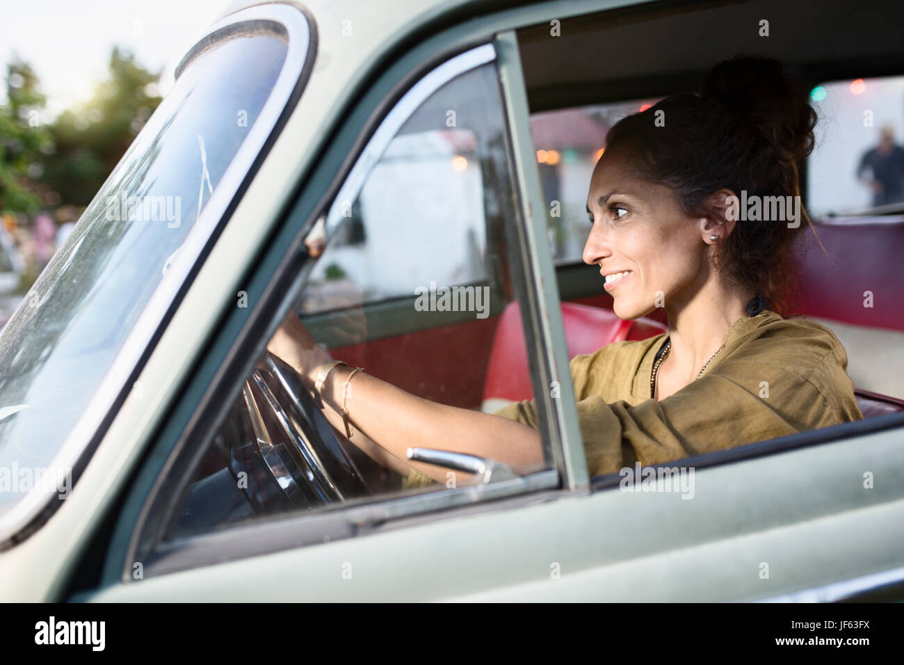 Smiling woman driving Stock Photo - Alamy