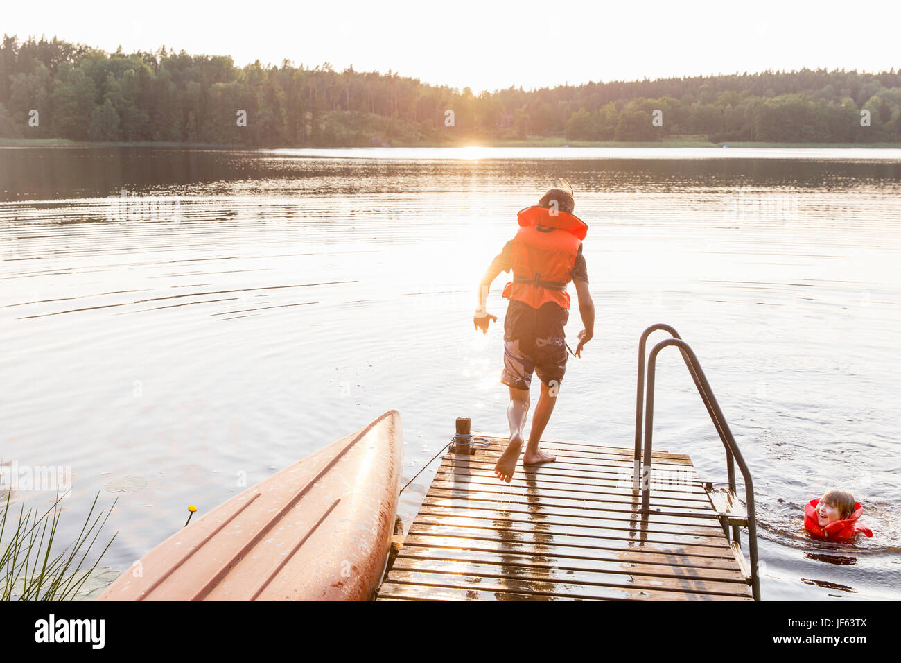 Children at lake Stock Photo - Alamy