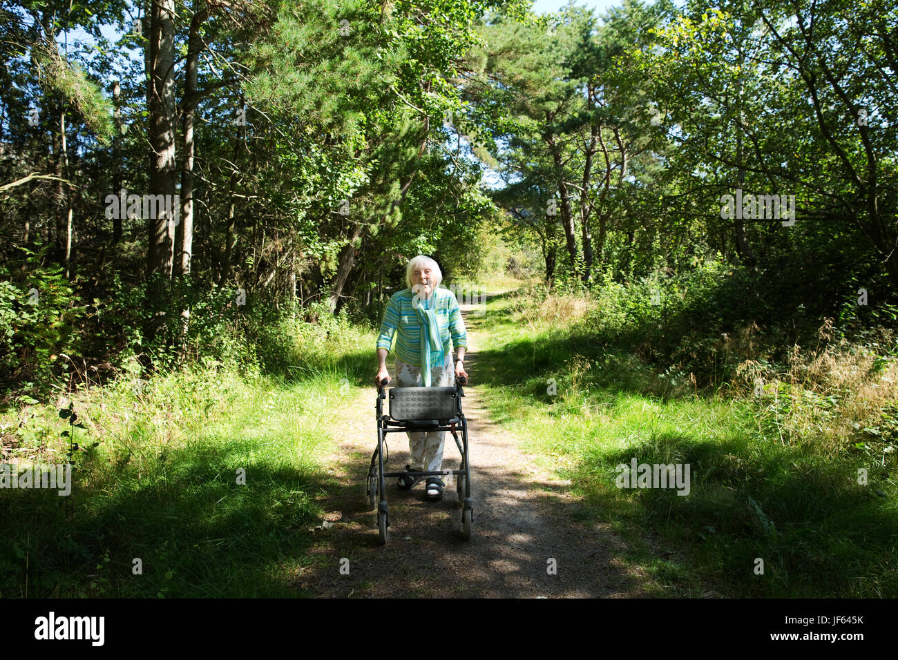 Woman walking frame hi-res stock photography and images - Alamy