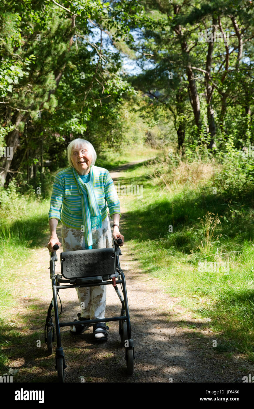 Woman walking frame hi-res stock photography and images - Alamy