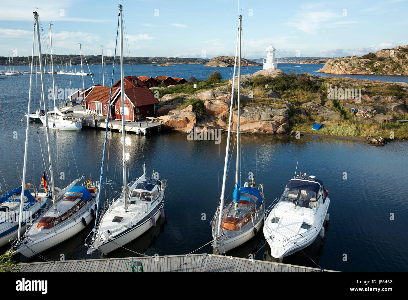 Sailing boats moored at coast Stock Photo - Alamy