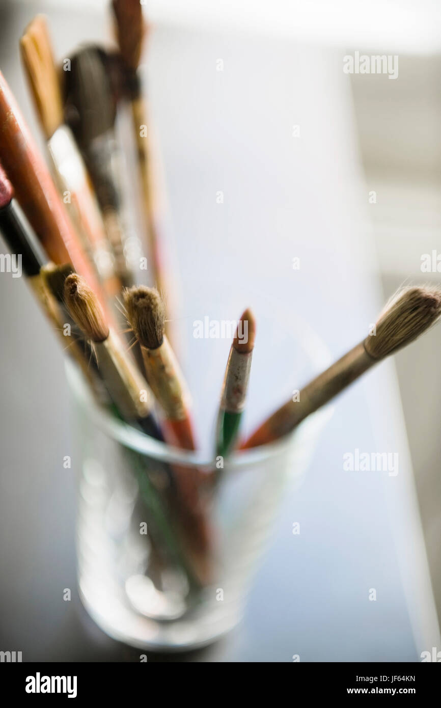 Paint brushes in glass Stock Photo - Alamy