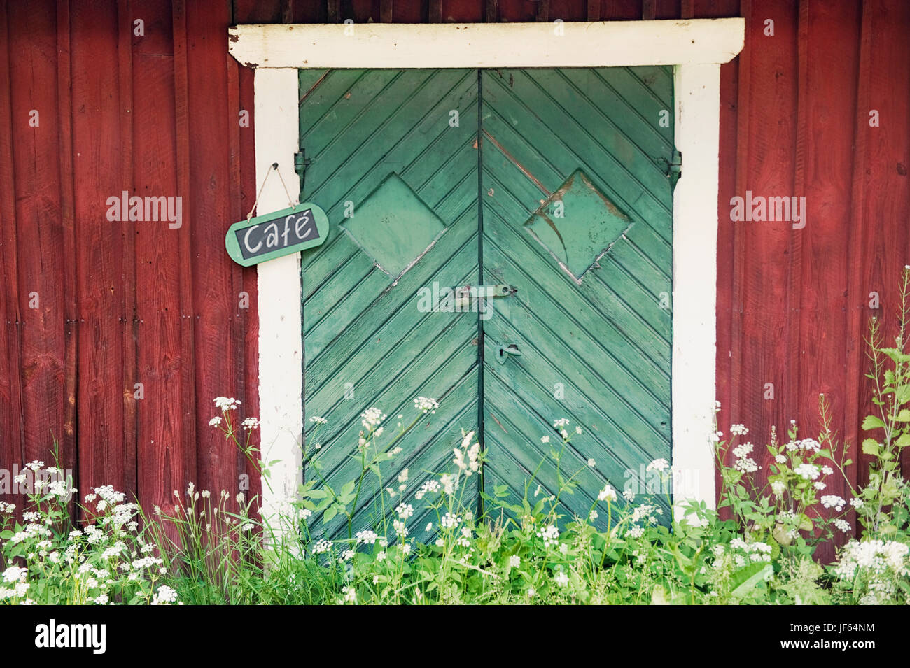 Cafe sign on green door Stock Photo - Alamy